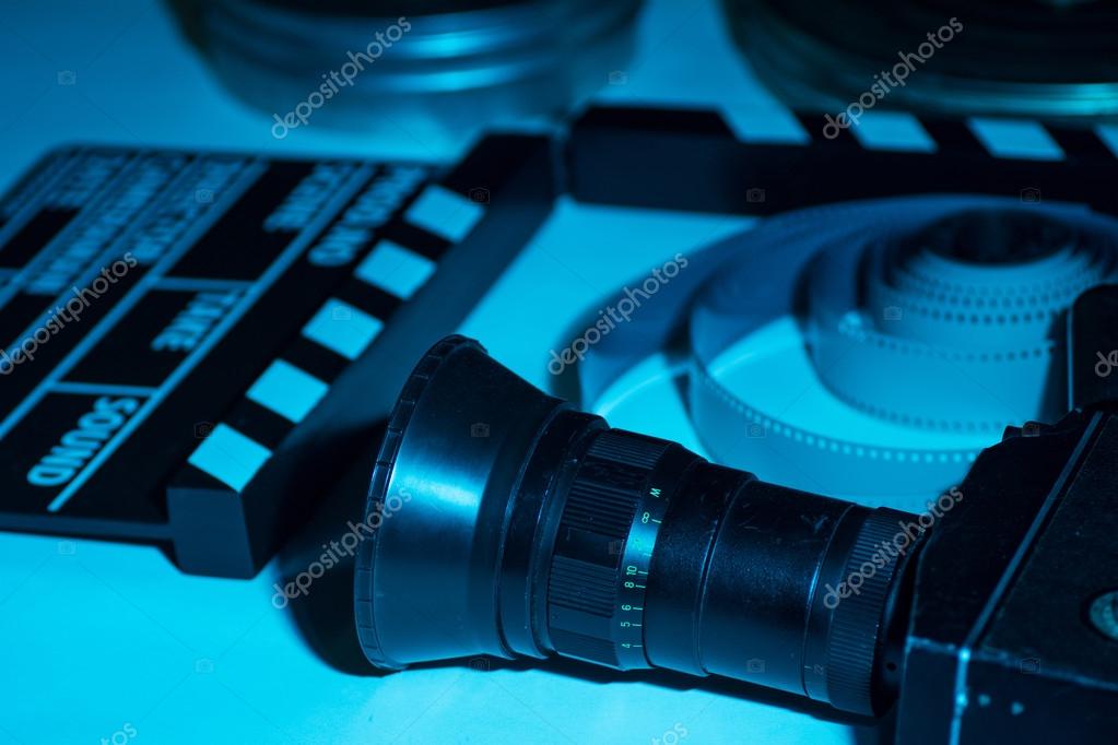 Old retro camera, film clapper, rolls of film and a 35mm box fil ...