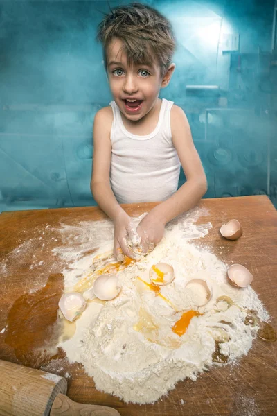 Little chefs enjoying in the kitchen making big mess - Stock Image ...