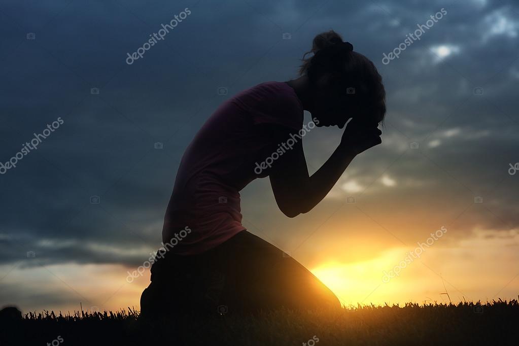 Praying at sunset — Stock Photo © kevron2002 #86642698
