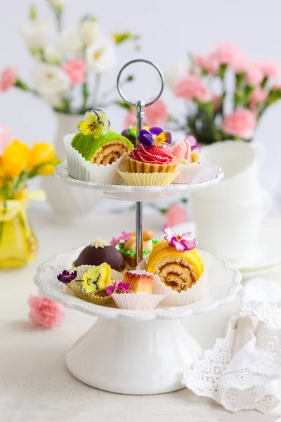 Assorted cakes and pastries on a cake Stock Photo by ©sarsmis 70821263