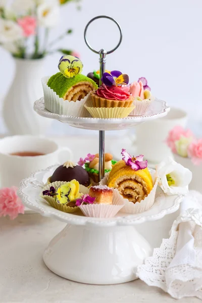 Assorted cakes and pastries on a cake Stock Photo by ©sarsmis 70821263