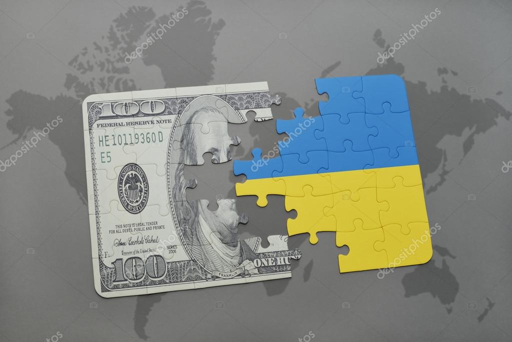 Puzzle with the national flag of ukraine and dollar banknote on a world ...