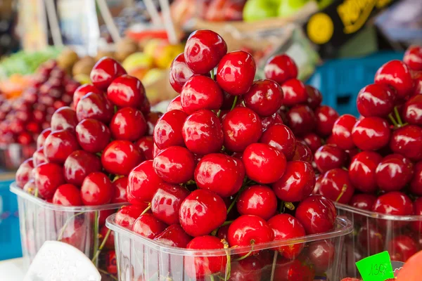 Display of cherries ready to eat at a market. - Stock Image - Everypixel