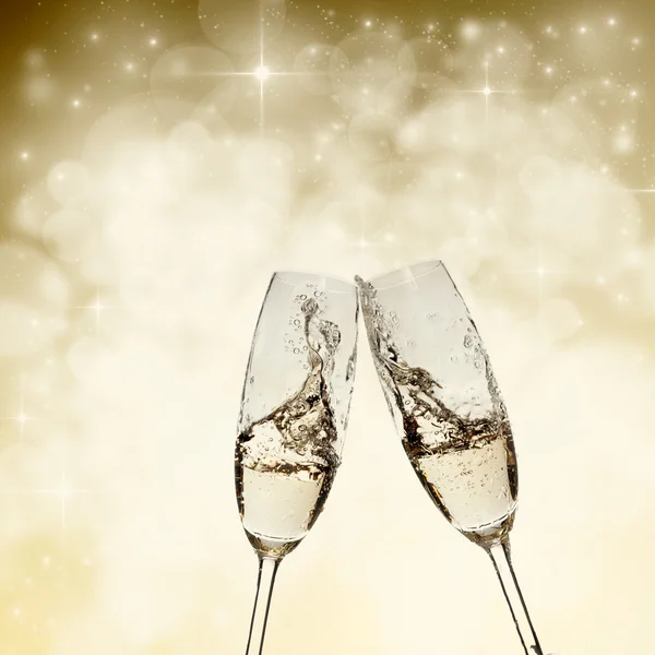 Toasting with champagne glasses on sparkling holiday background Stock ...