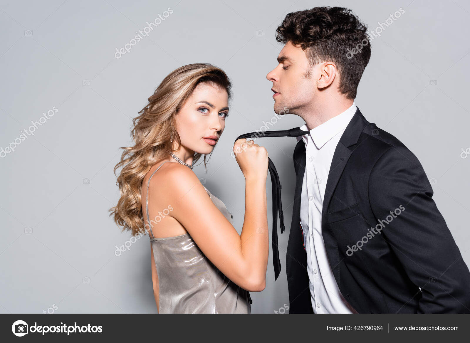 Elegant Young Woman Holding Tie Man Suit Isolated Grey Stock Photo by ...