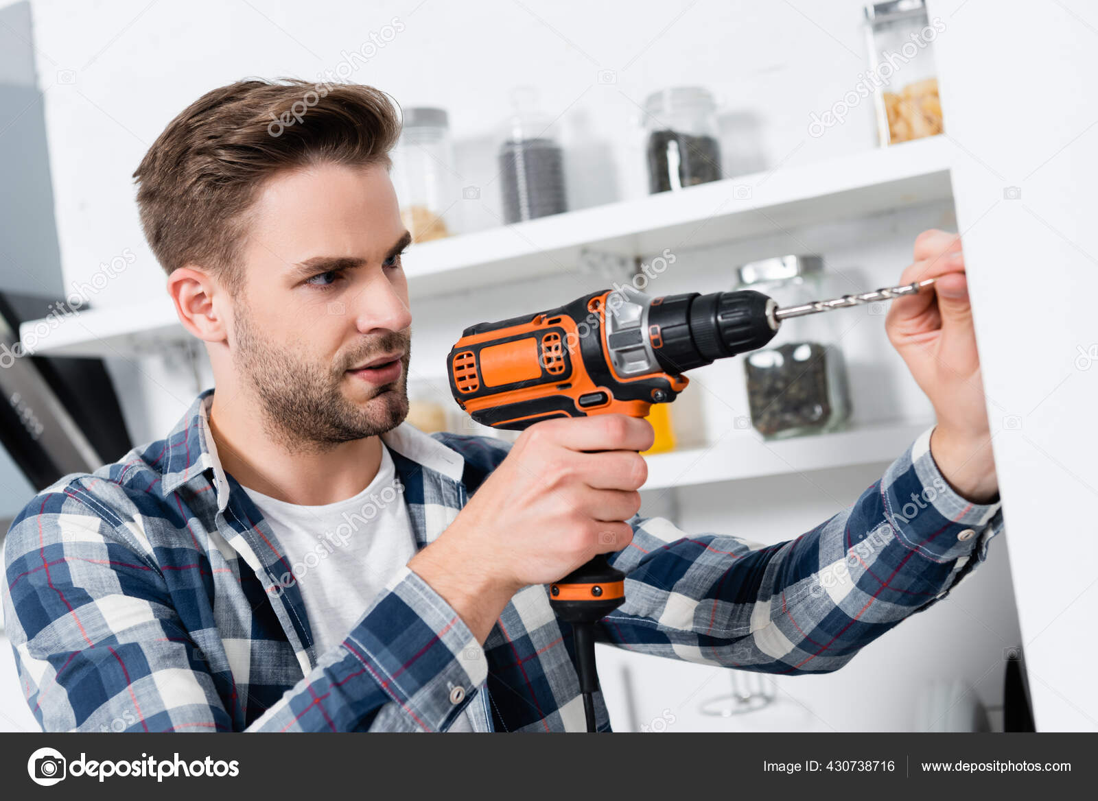 Focused Young Man Using Drill Blurred Background Kitchen — Stock Photo ...
