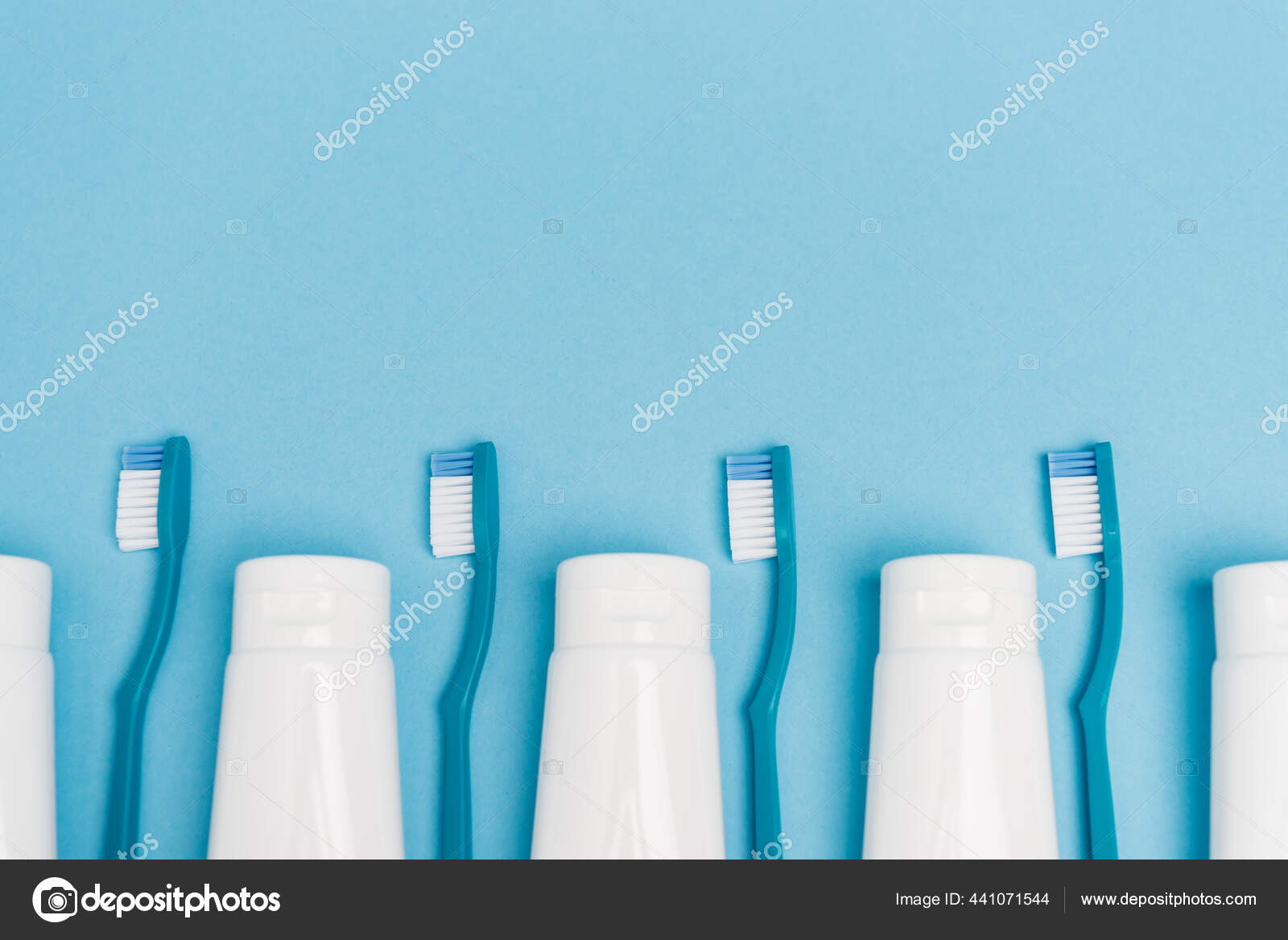 Top View Row Toothbrushes Tubes Toothpaste Blue Background Stock Photo ...