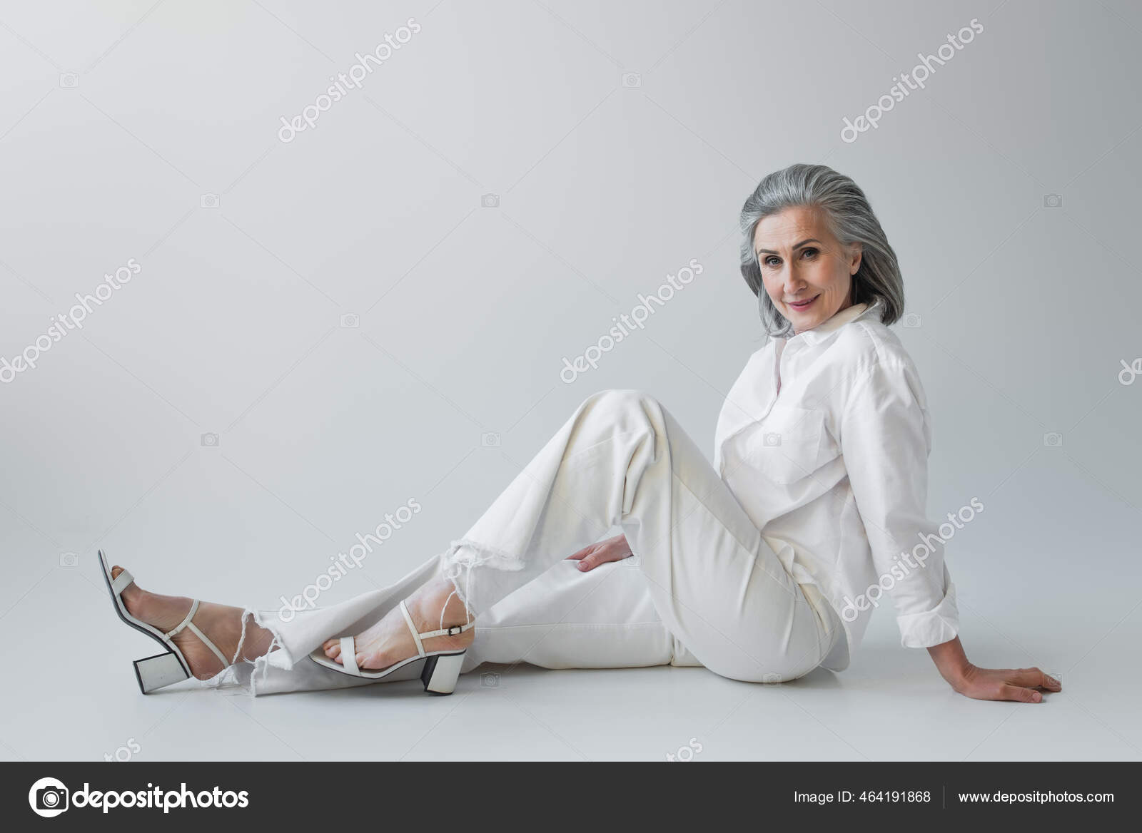 Grey Haired Woman Looking Camera While Sitting Grey Background Stock ...