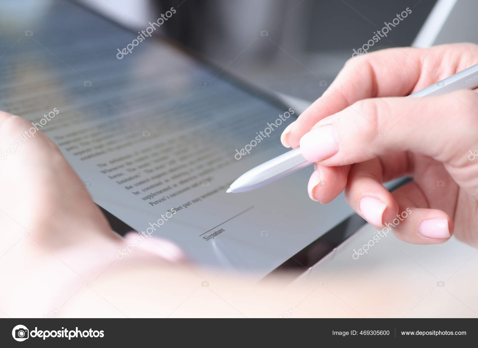 Woman hand holds stylus and puts an electronic signature in contract on ...