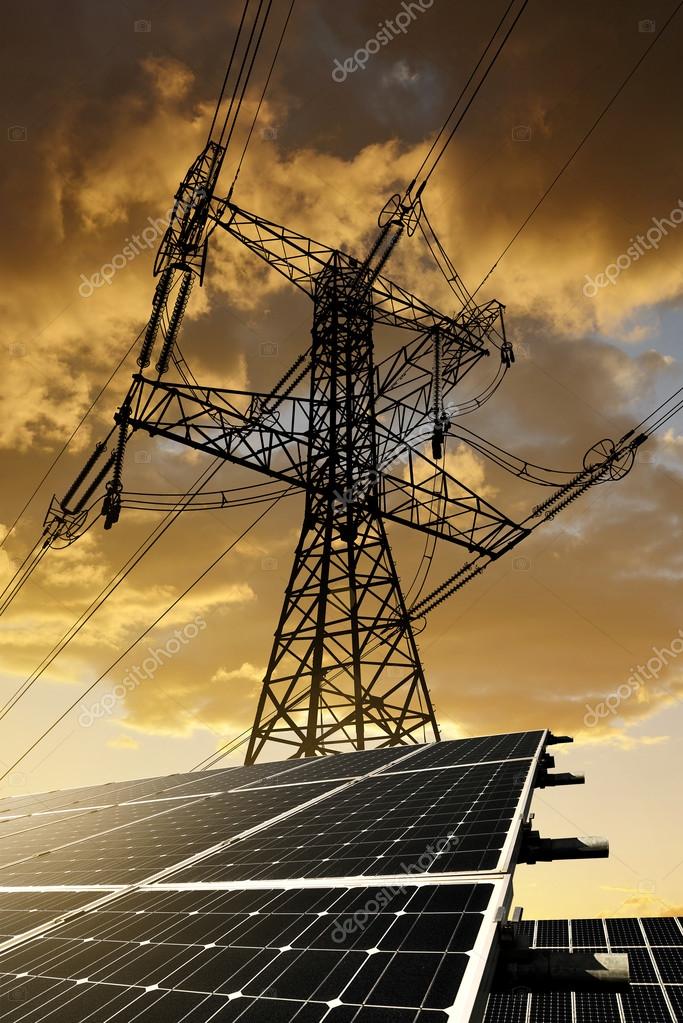 Solar panels with electricity pylon at sunset. — Stock Photo © vencav ...