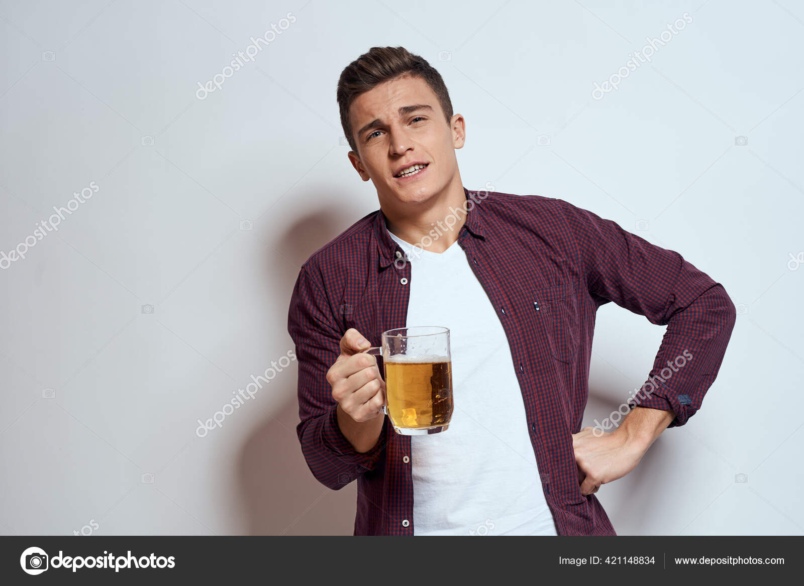 Drunk man with a mug of beer vacation alcohol lifestyle in a red shirt ...