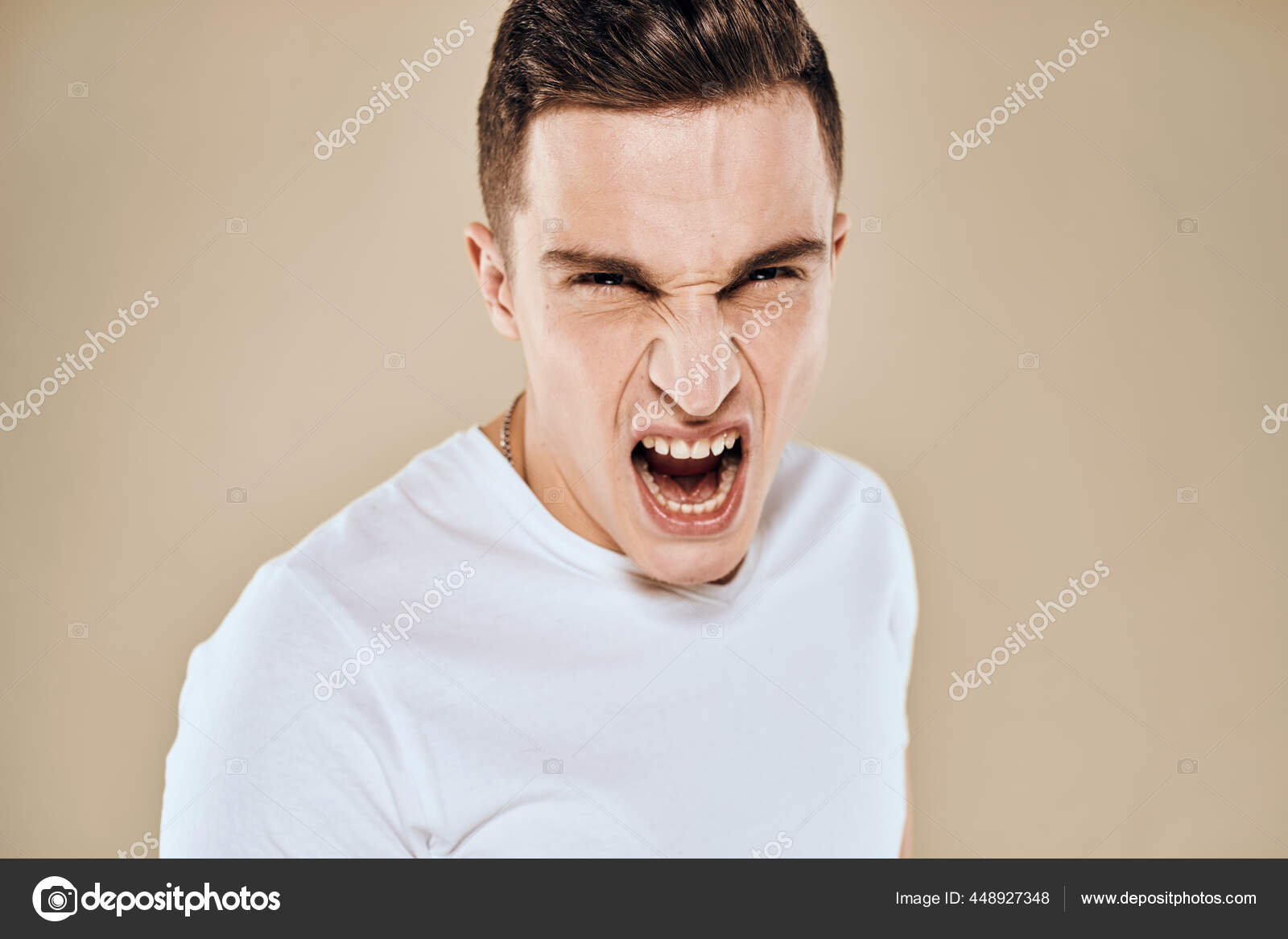 Man with displeased facial expression emotions white t-shirt gestures ...