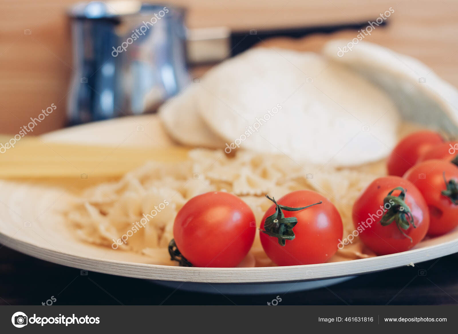Italian cuisine pasta cooking wood table lunch tomatoes Stock Photo by ...