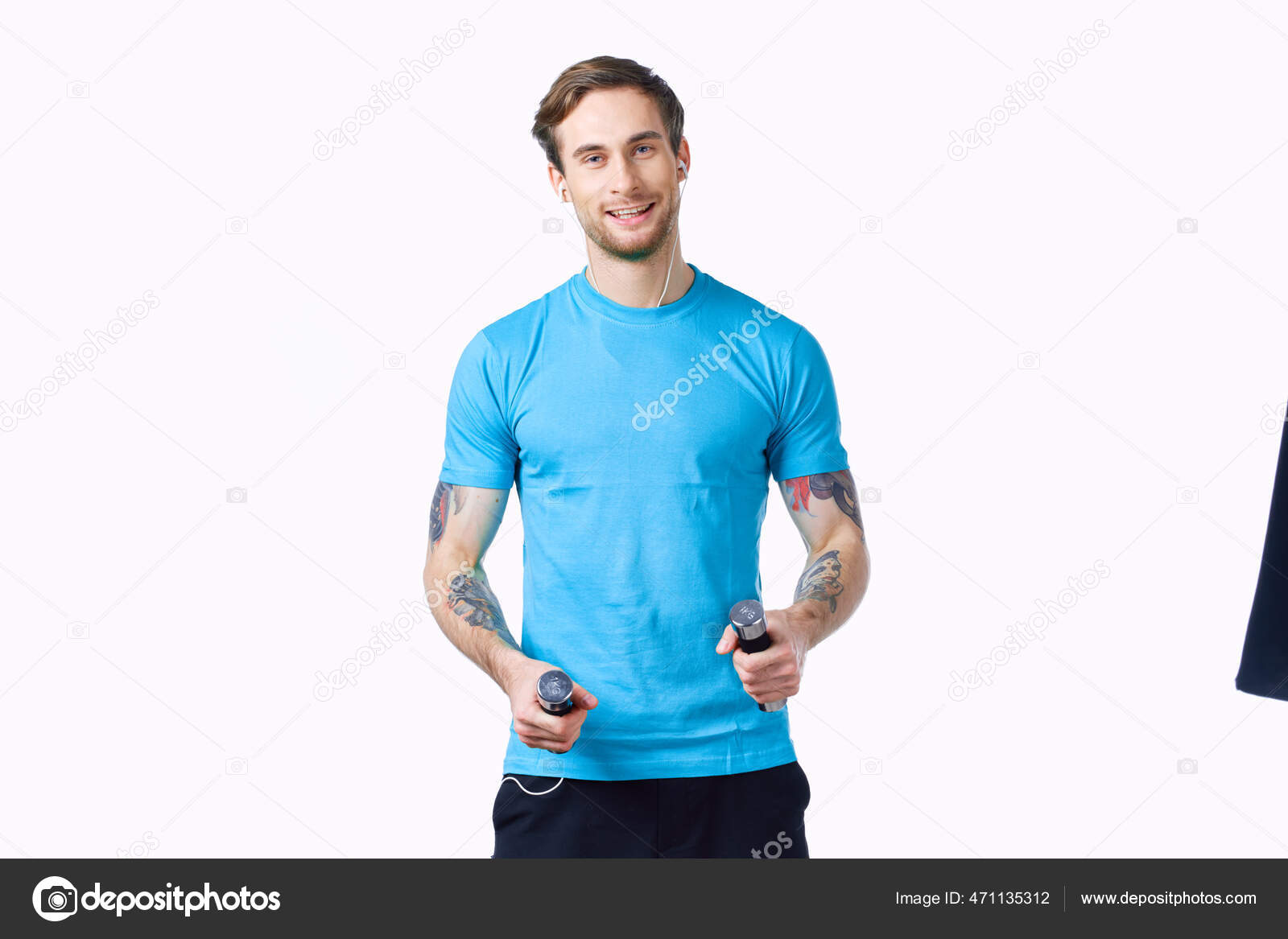 Man with inflated arm muscles shows finger to the side and dumbbells ...