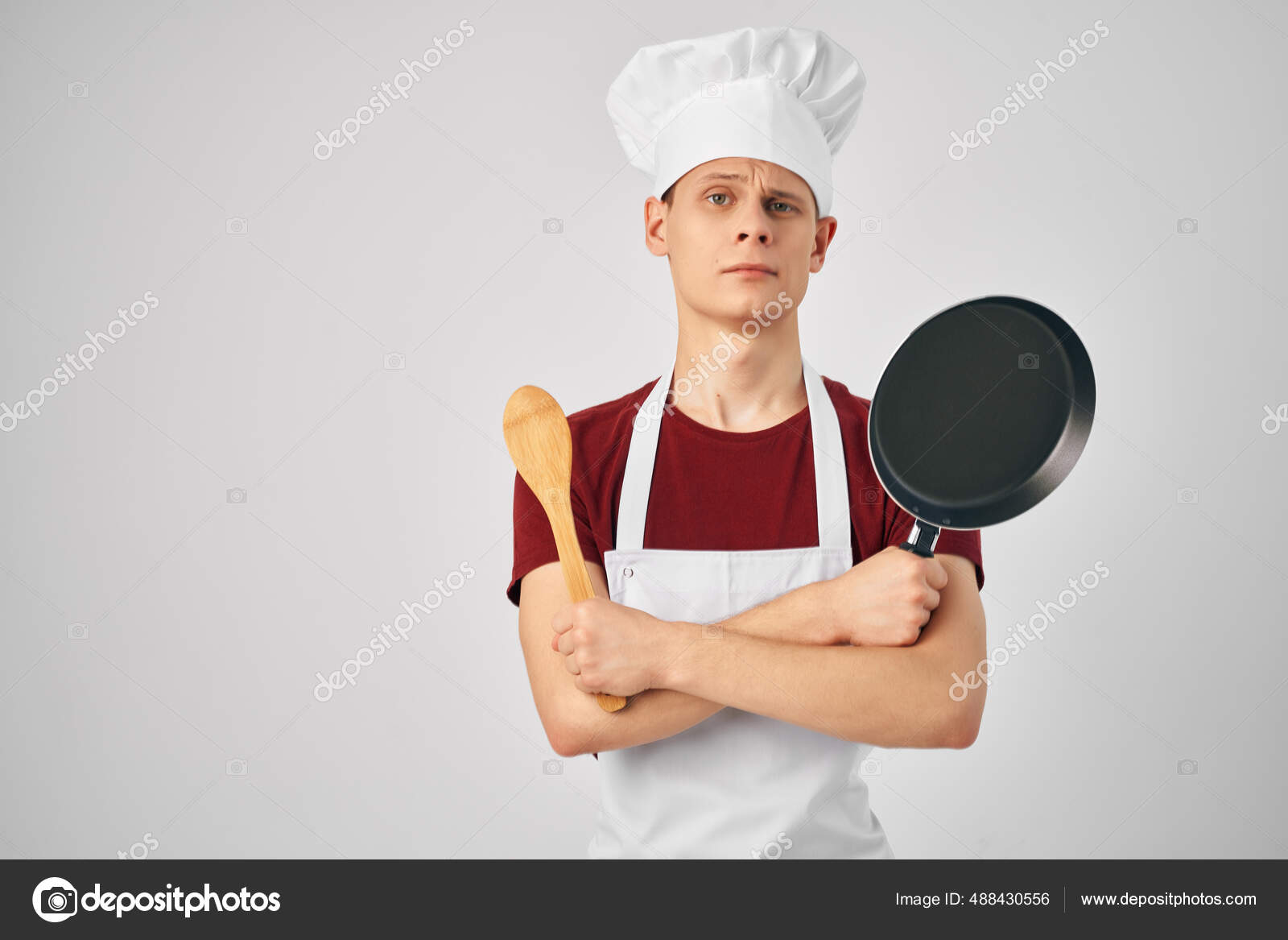 Chef with a cap on his head Frying pan in his hands preparing food ...