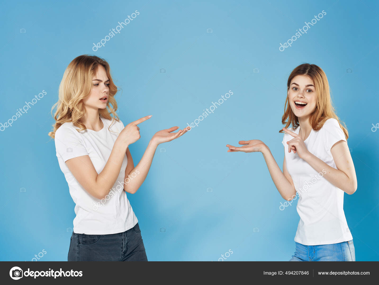 Two cute girlfriends in white t-shirts hugs emotions fashion blue ...