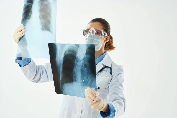 X-ray doctor wearing a medical mask X-rays examination in a hospital ...