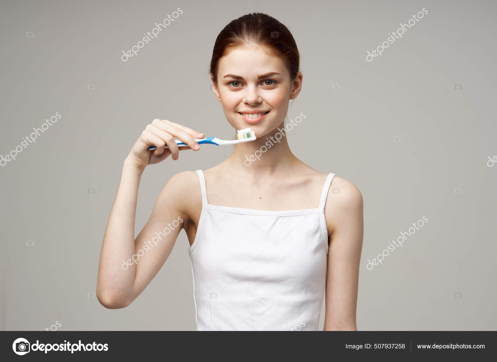 Pretty woman toothpaste brushing teeth dental health studio lifestyle ...