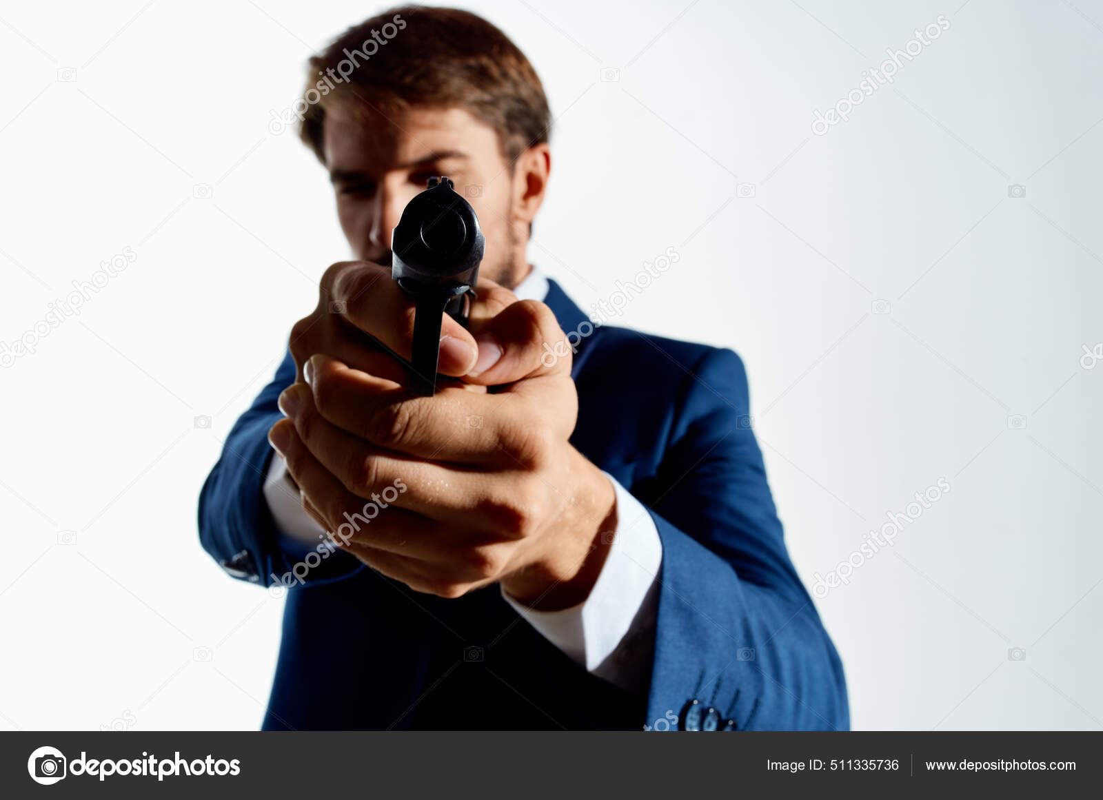 Man gun in the hands of the mafia emotions Agent light background ...