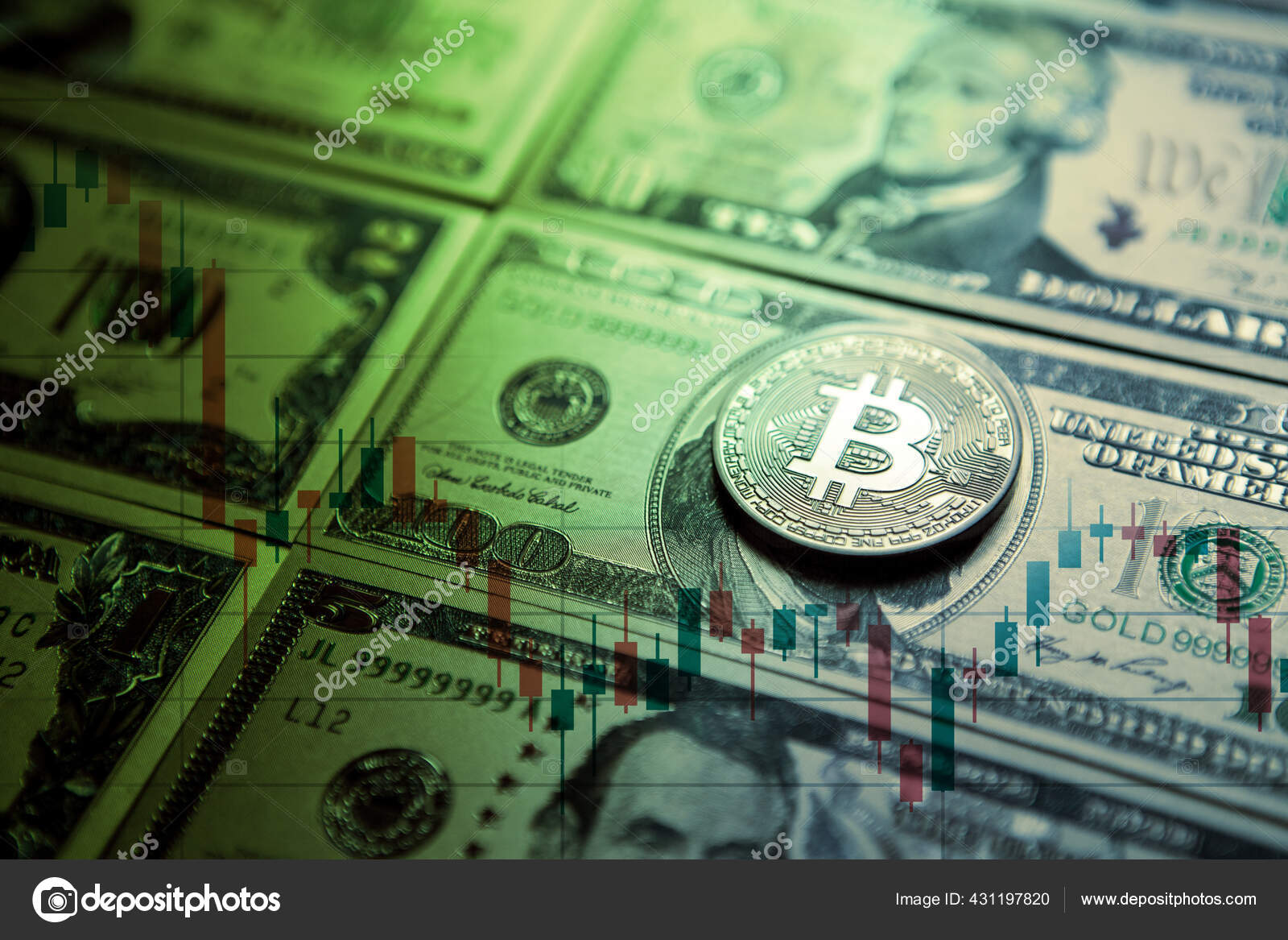 Gold bitcoins on a stack of coins with chart of growing and falling ...