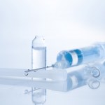 Syringe and medicine for injection Stock Photo by ©Kuzmafoto 15818781