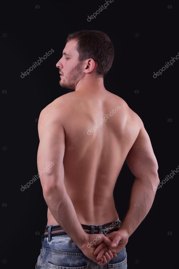 Rear view of a well-built young man — Stock Photo © MyraLypa #61715949