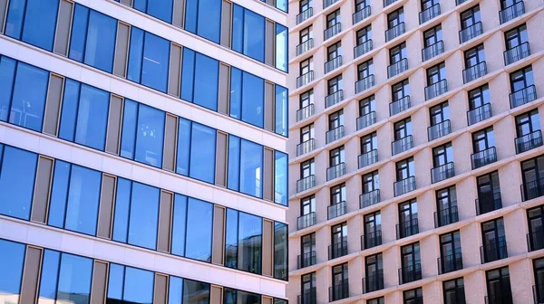 Facade texture of a glass mirrored office building. A beautiful ...