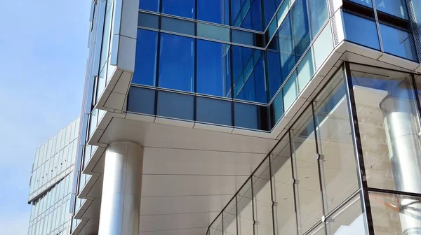 Facade texture of a glass mirrored office building. A beautiful ...