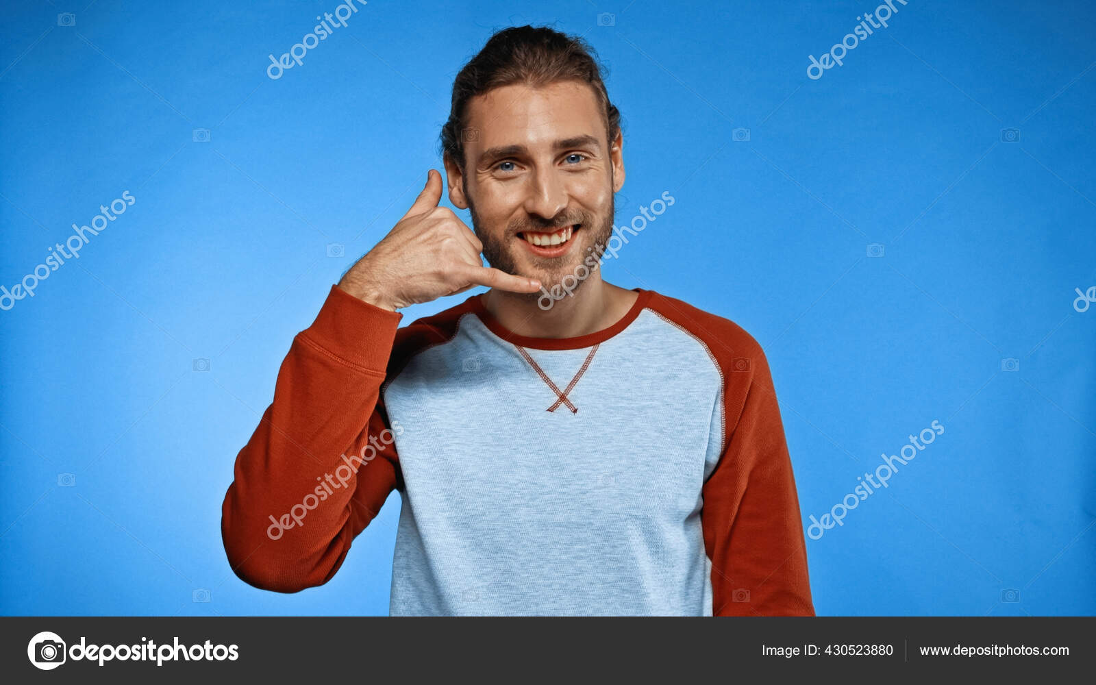 Smiling Young Man Showing Call Gesture While Looking Camera Blue ...