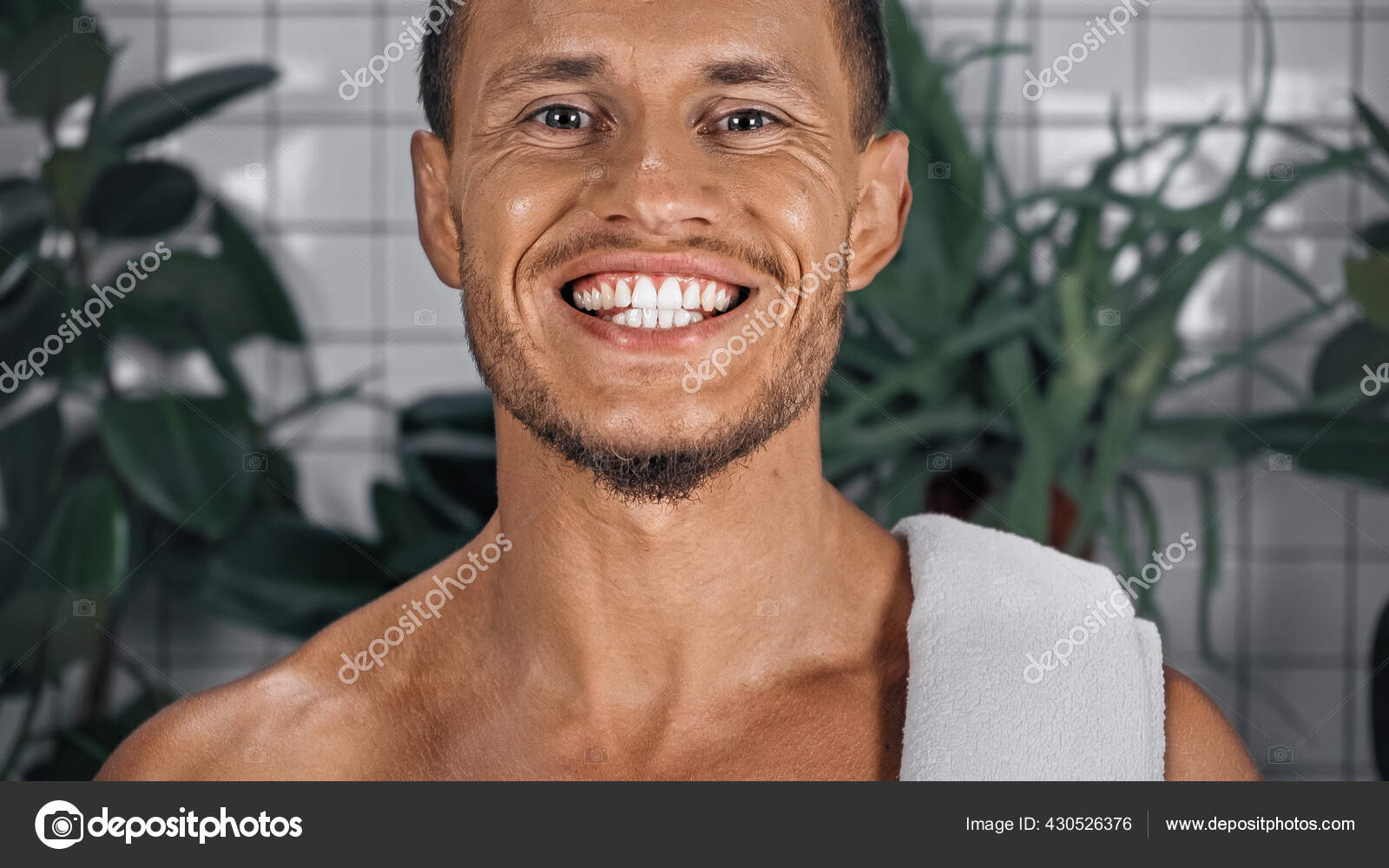 Happy Man Showing White Teeth While Smiling Bathroom Plants Blurred ...