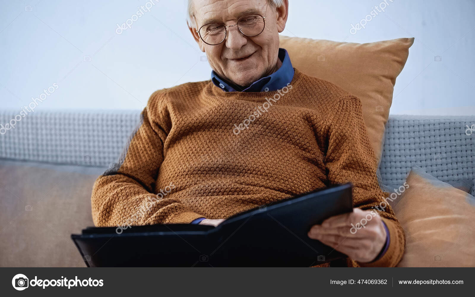 Happy Elderly Man Sitting Sofa Family Album Living Room Stock Photo by ...