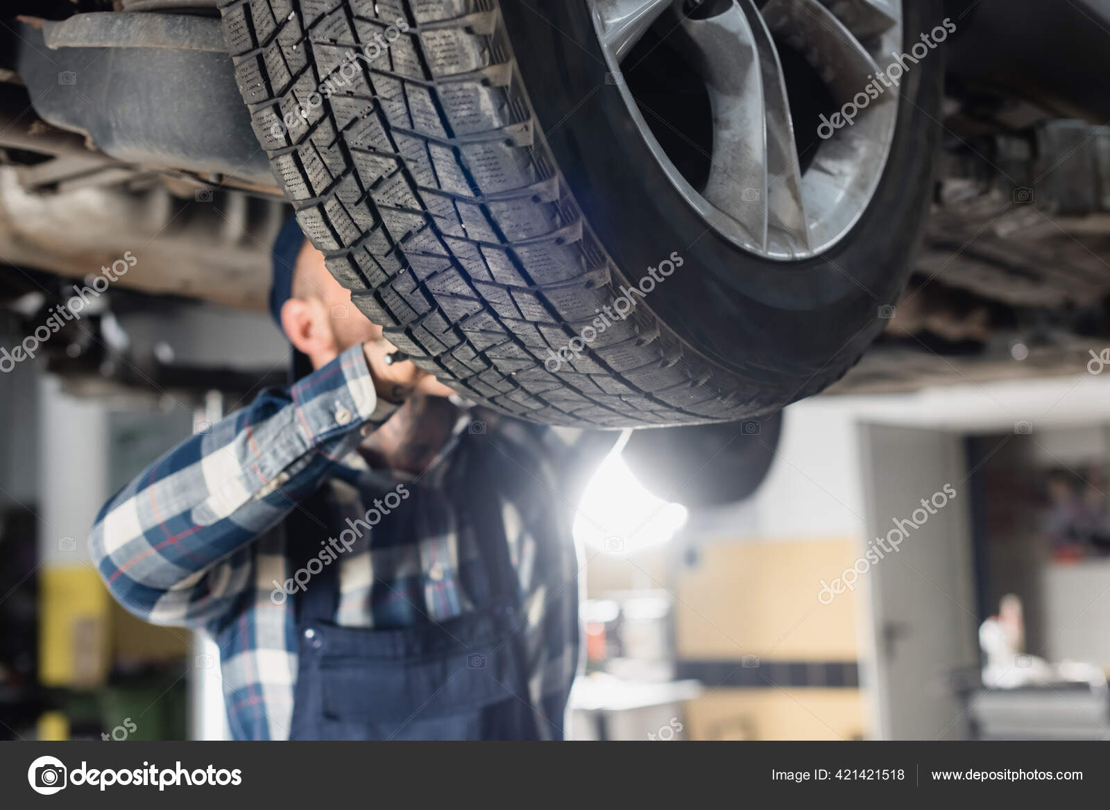 Cropped View Mechanic Checking Wheel Car Blurred Background Stock Photo ...