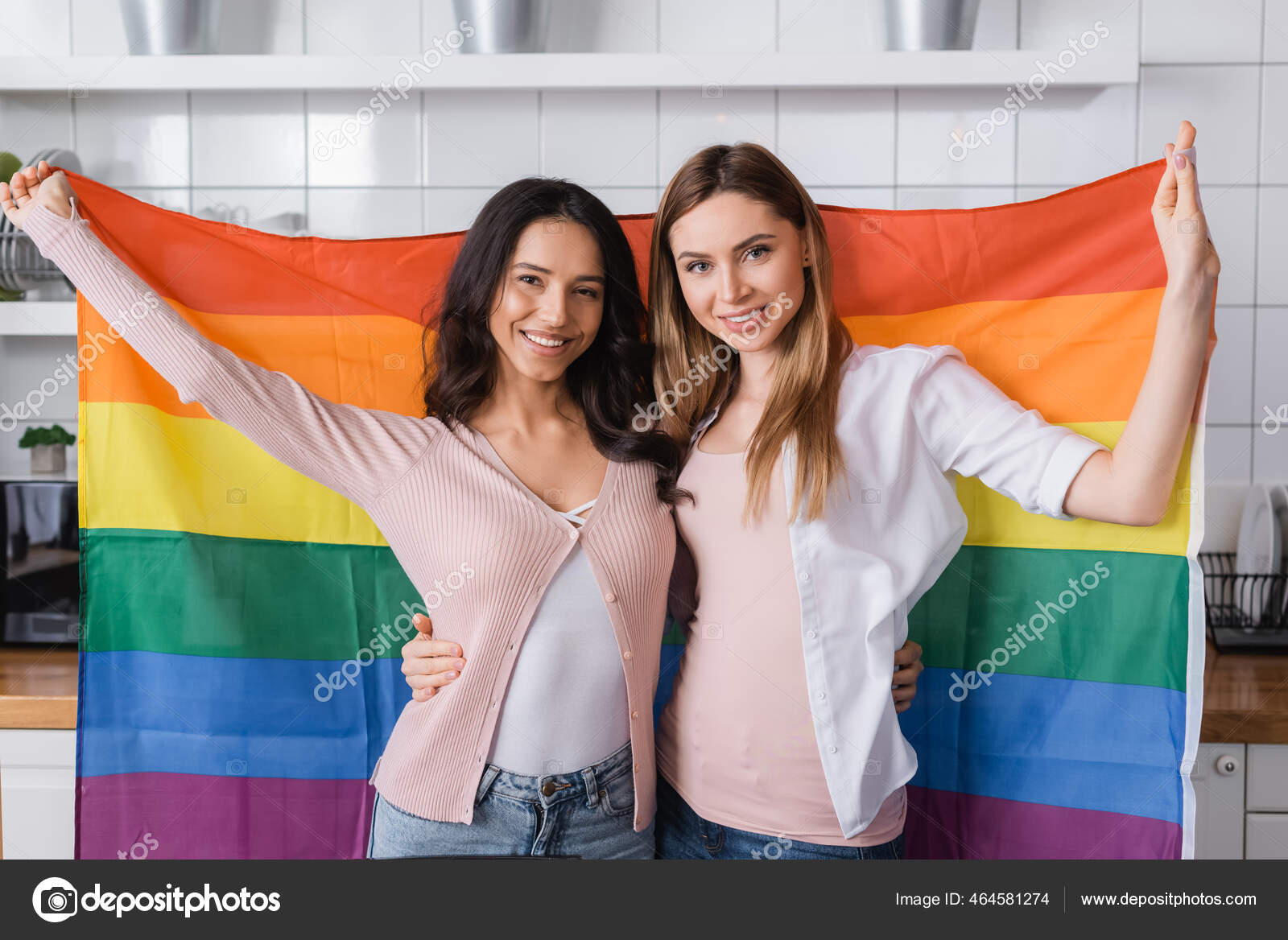 Cheerful Lesbian Couple Holding Lgbt Flag Stock Photo by ©AndrewLozovyi ...