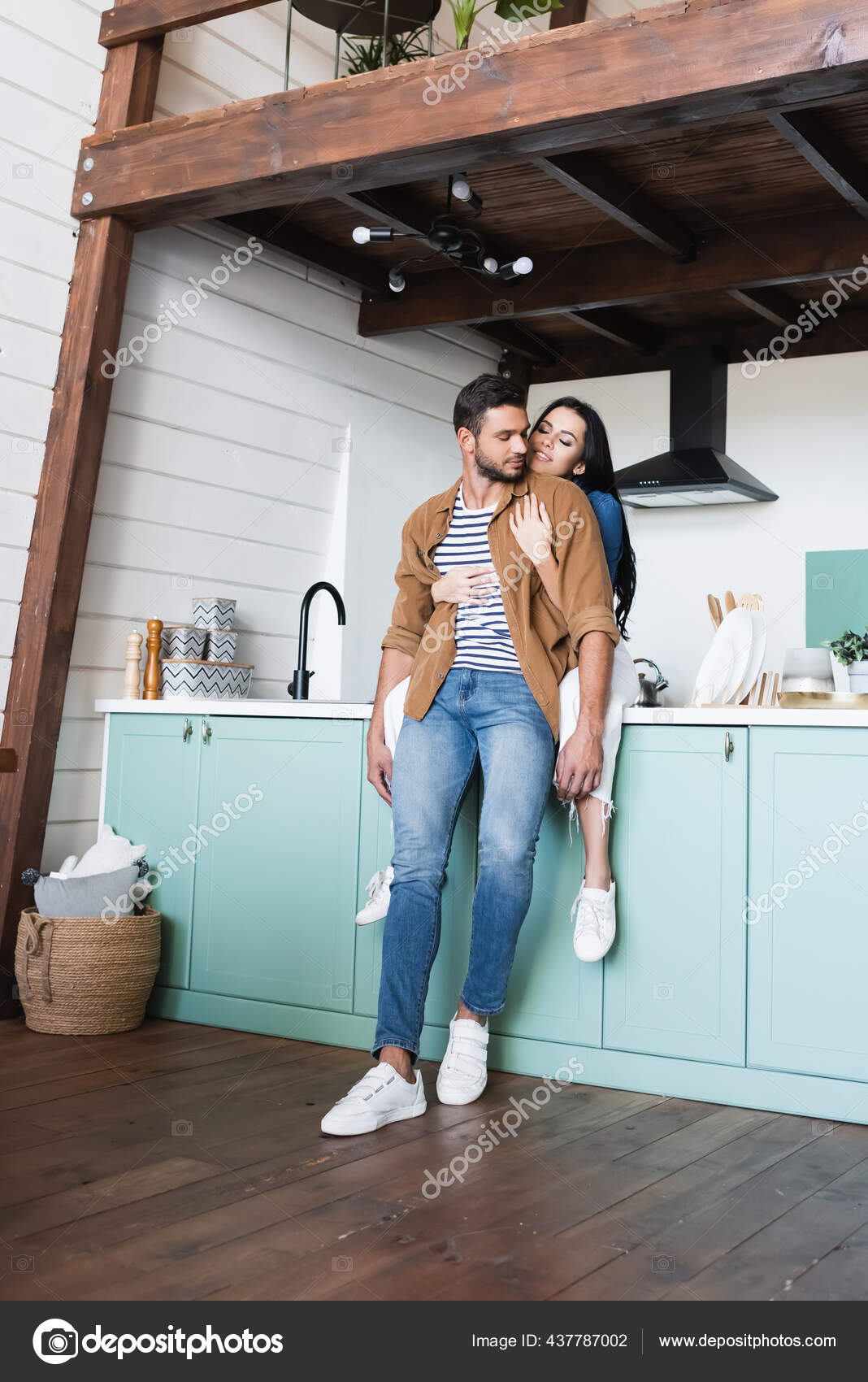 Smiling Brunette Woman Embracing Young Boyfriend While Sitting Kitchen ...