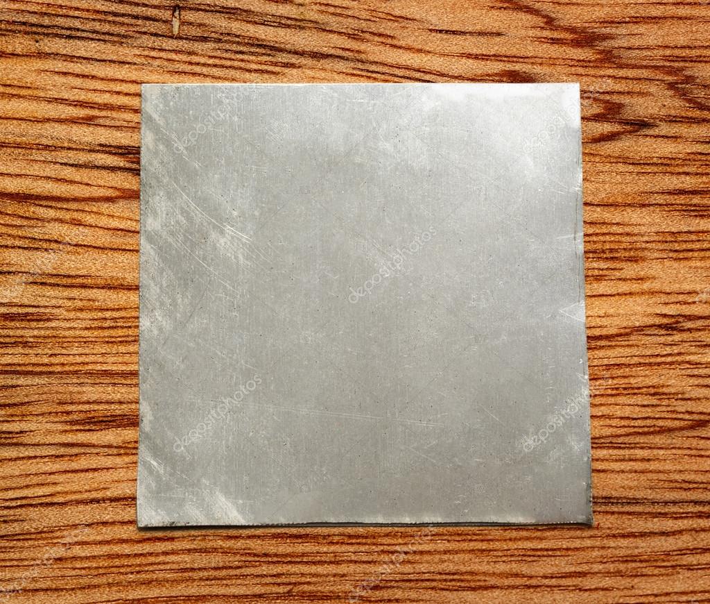 Blank square metal plate Stock Photo by ©Garsya 112272404