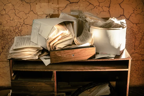 Table and stack of paper — Stock Photo © Garsya #65788861
