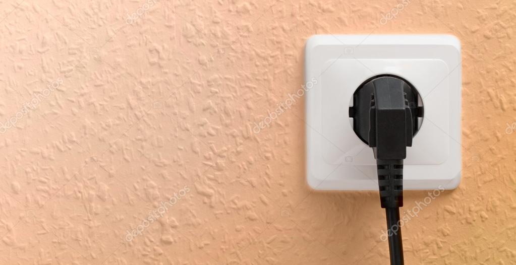 Single electric socket with plug Stock Photo by ©Garsya 65788341