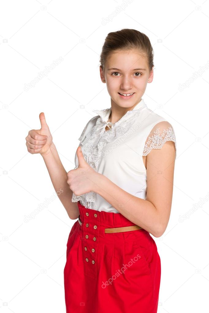 Teen girl with her thumbs up — Stock Photo © SergiyN #66865811