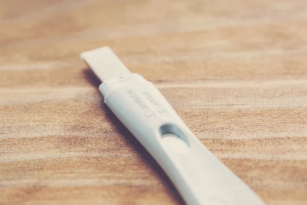 Positive pregnancy test result with two strips on the table. Two ...