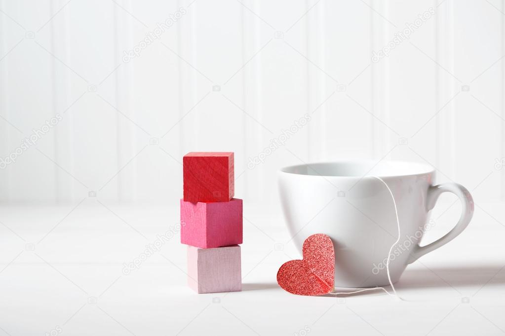 Coffee cup with wooden blocks Stock Photo by ©Melpomene 118849348