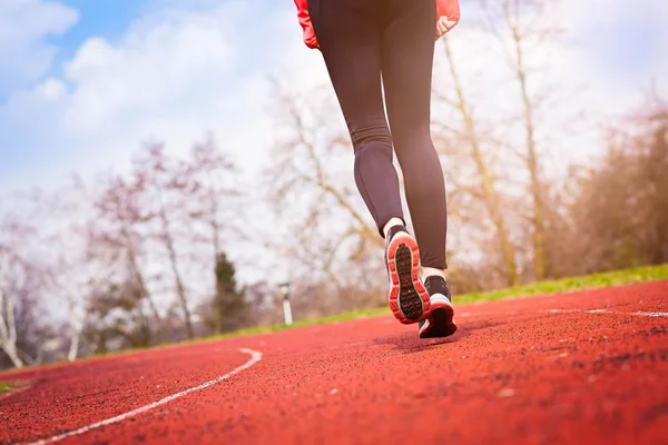 Runner feet running on stadium - Stock Image - Everypixel
