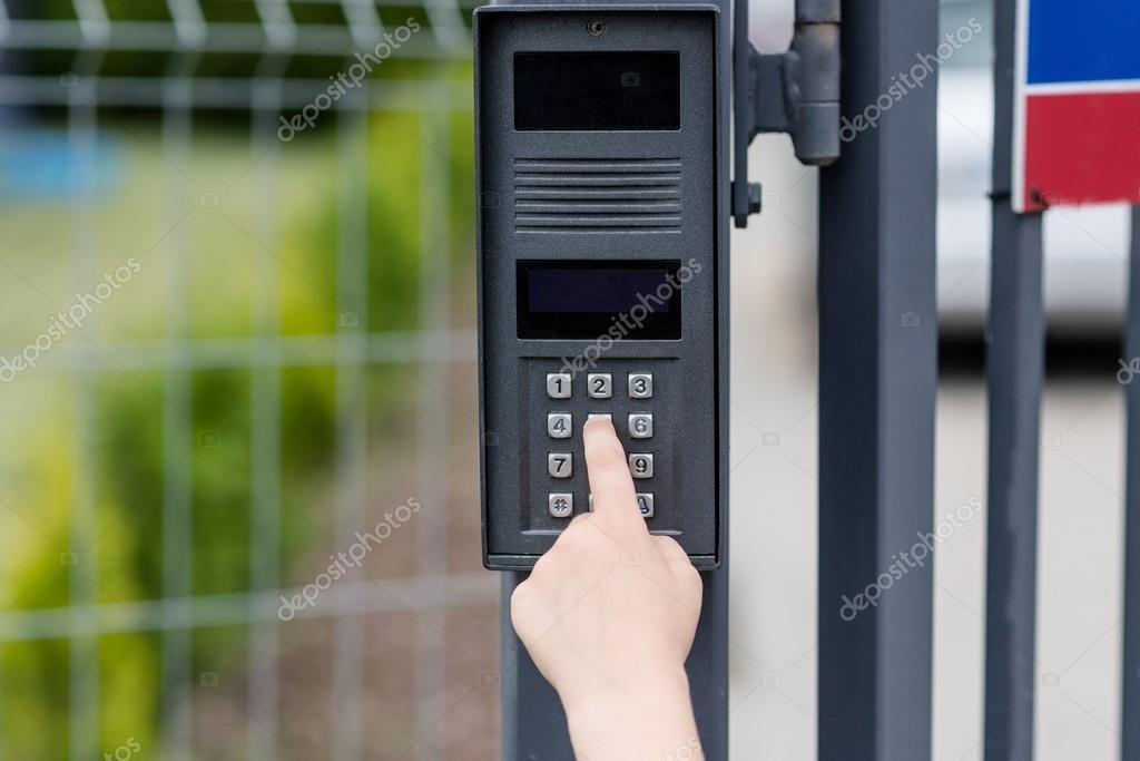 Little child boy pushes a button on the intercom — Stock Photo ...