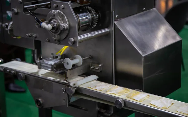 Process of dough sheet pressing machine in food industry - Stock Image ...