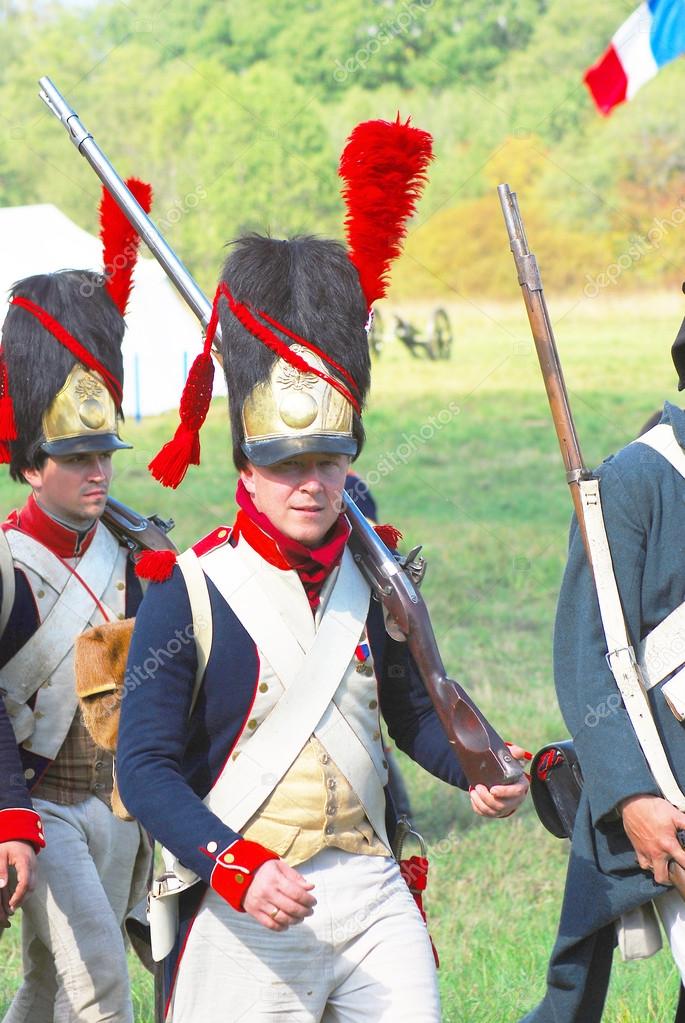 Reenactors dressed as Napoleonic war French soldiers march on the ...