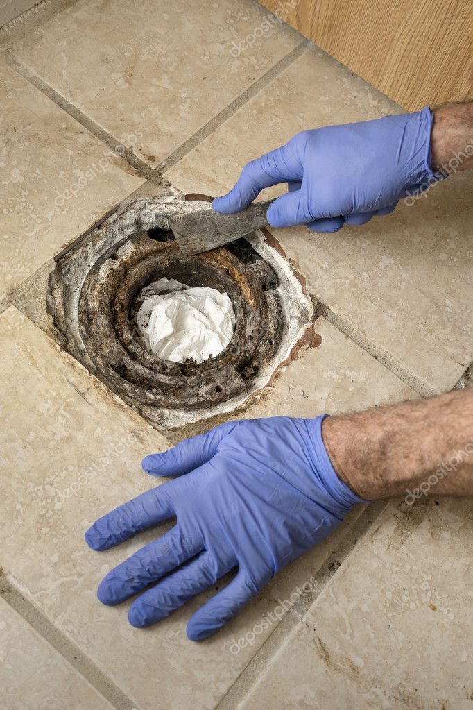 Man Scraping Below Grade Toilet Flange Stock Photo by ©forestpath 104775472