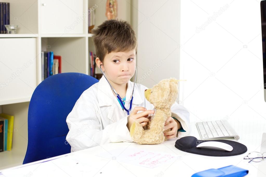 Cute little doctor at work with patient — Stock Photo © fabianaponzi ...