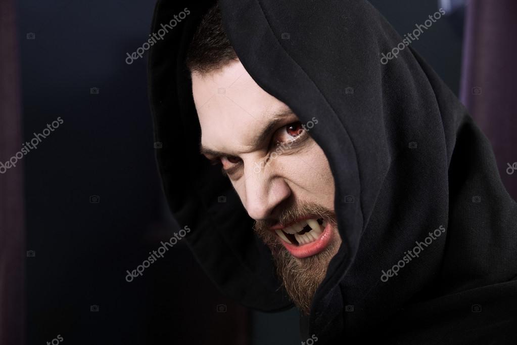 Angry vampire with red eyes Stock Photo by ©fabianaponzi 70596075