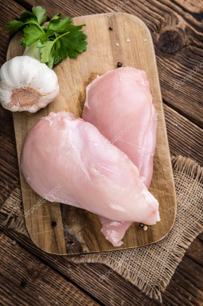 Pieces of fresh Chicken Fillets Stock Photo by ©HandmadePicture 114715720