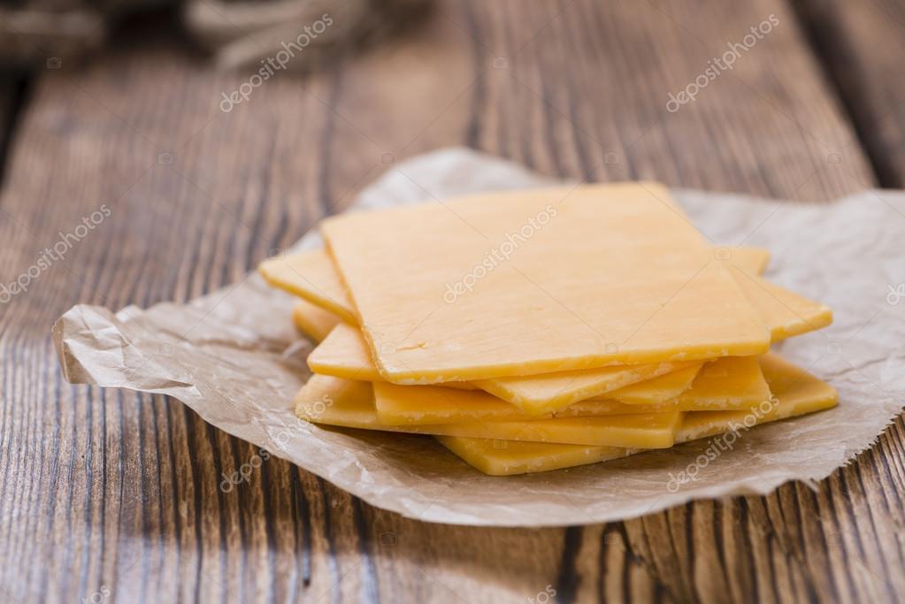 Cheddar cheese Slices Stock Photo by ©HandmadePicture 69584075