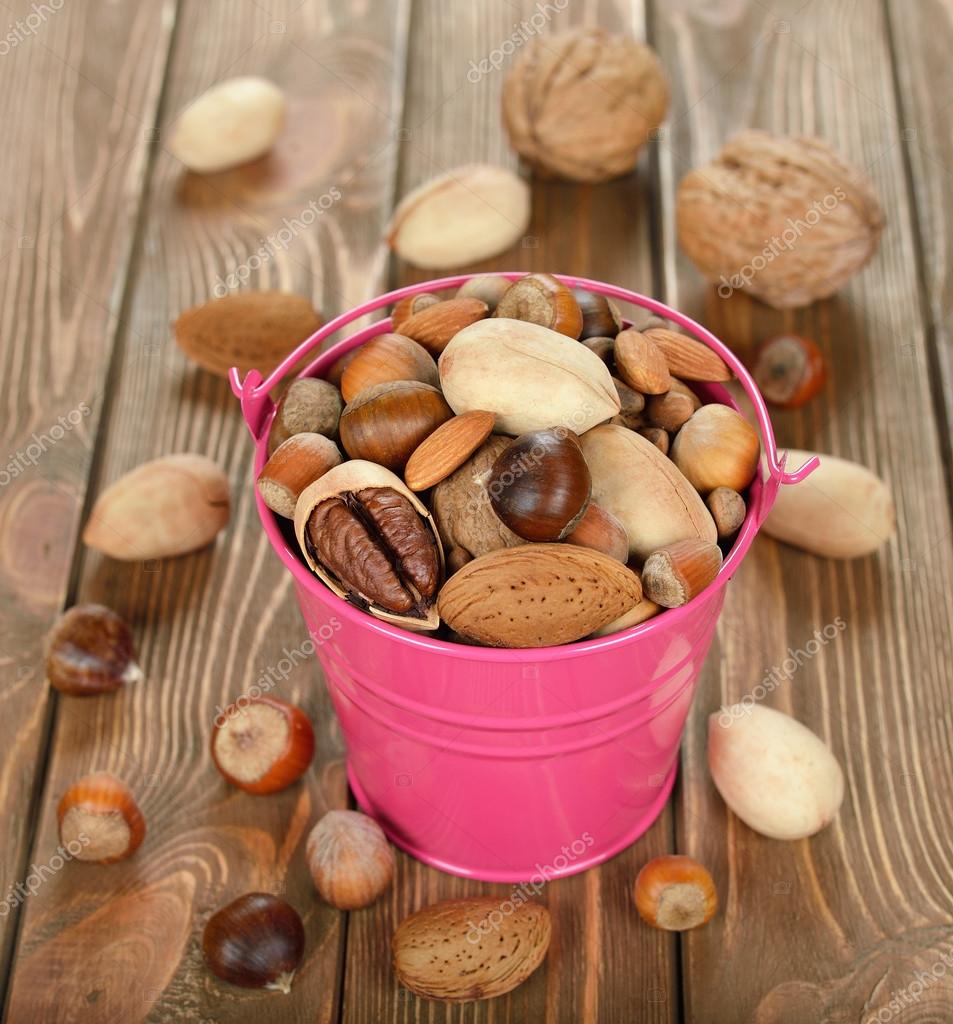 Nuts in a bucket Stock Photo by ©Olyina 61400061